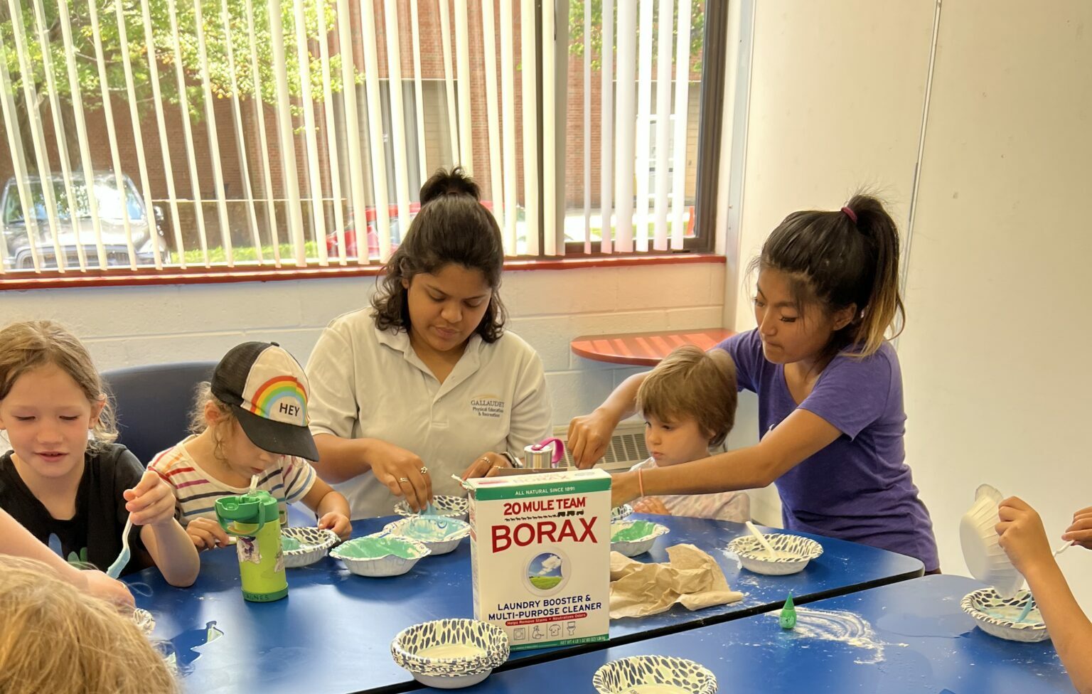 Faculty and students help kids play in ASL at Camp Discovery | Physical ...